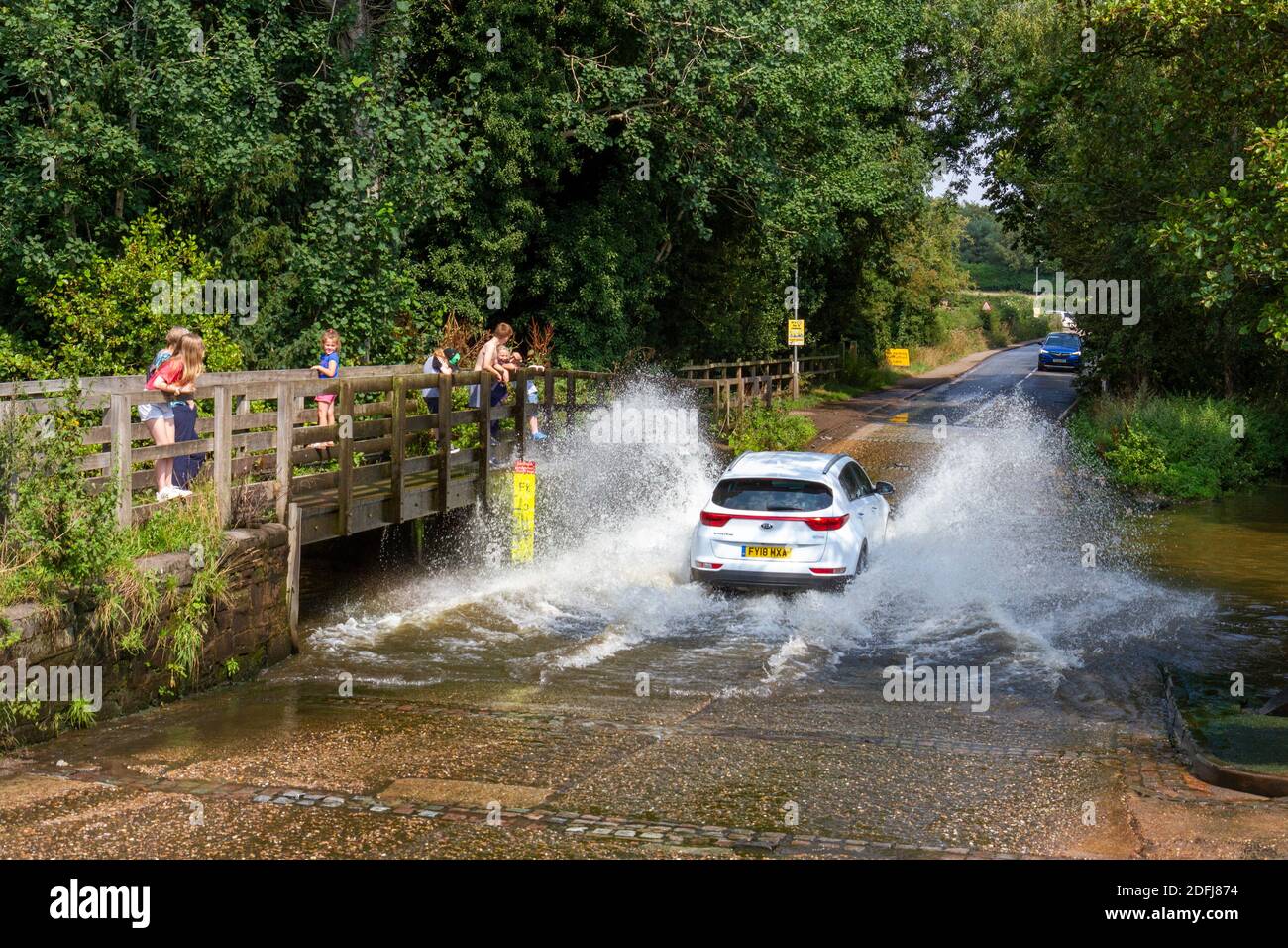 Car splashing through Rufford Ford, Rufford Lane, Rufford Country Park ...