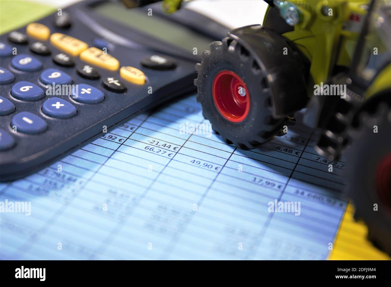 tractor and coins Stock Photo - Alamy