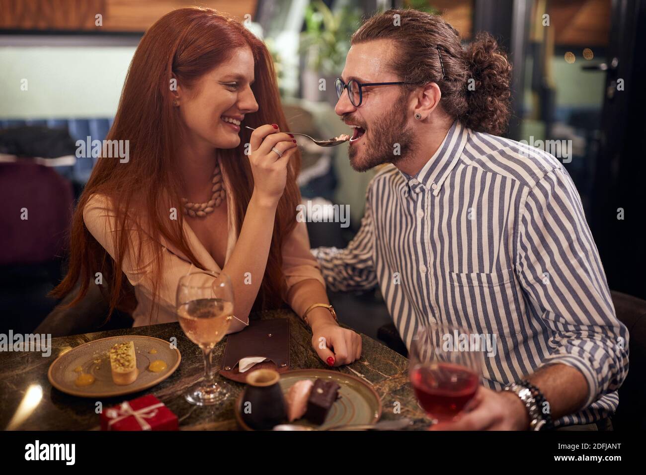 Happy couple on a romantic dinner together Stock Photo - Alamy