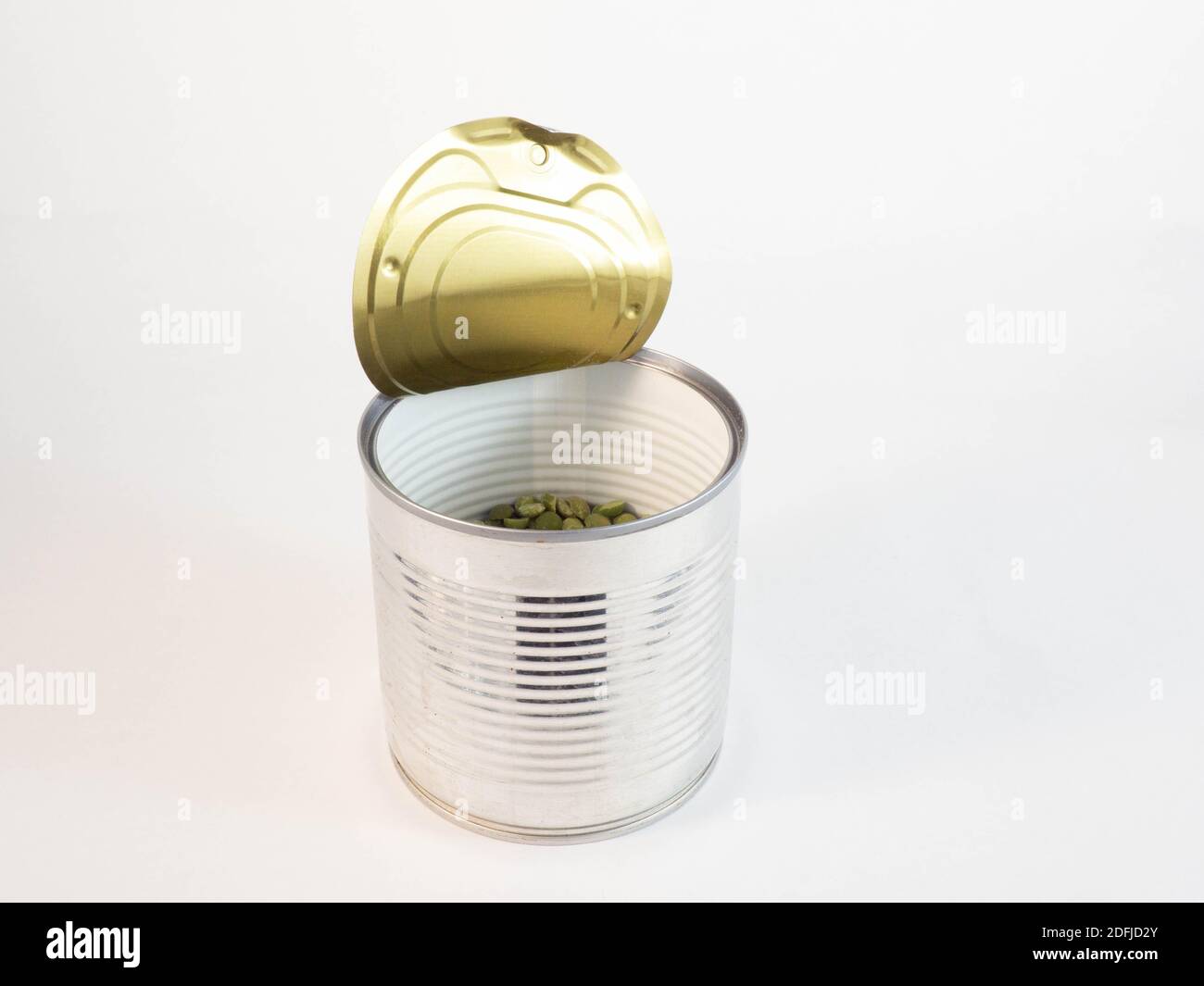 A tin can with split peas. Concept around food and consumption Stock ...