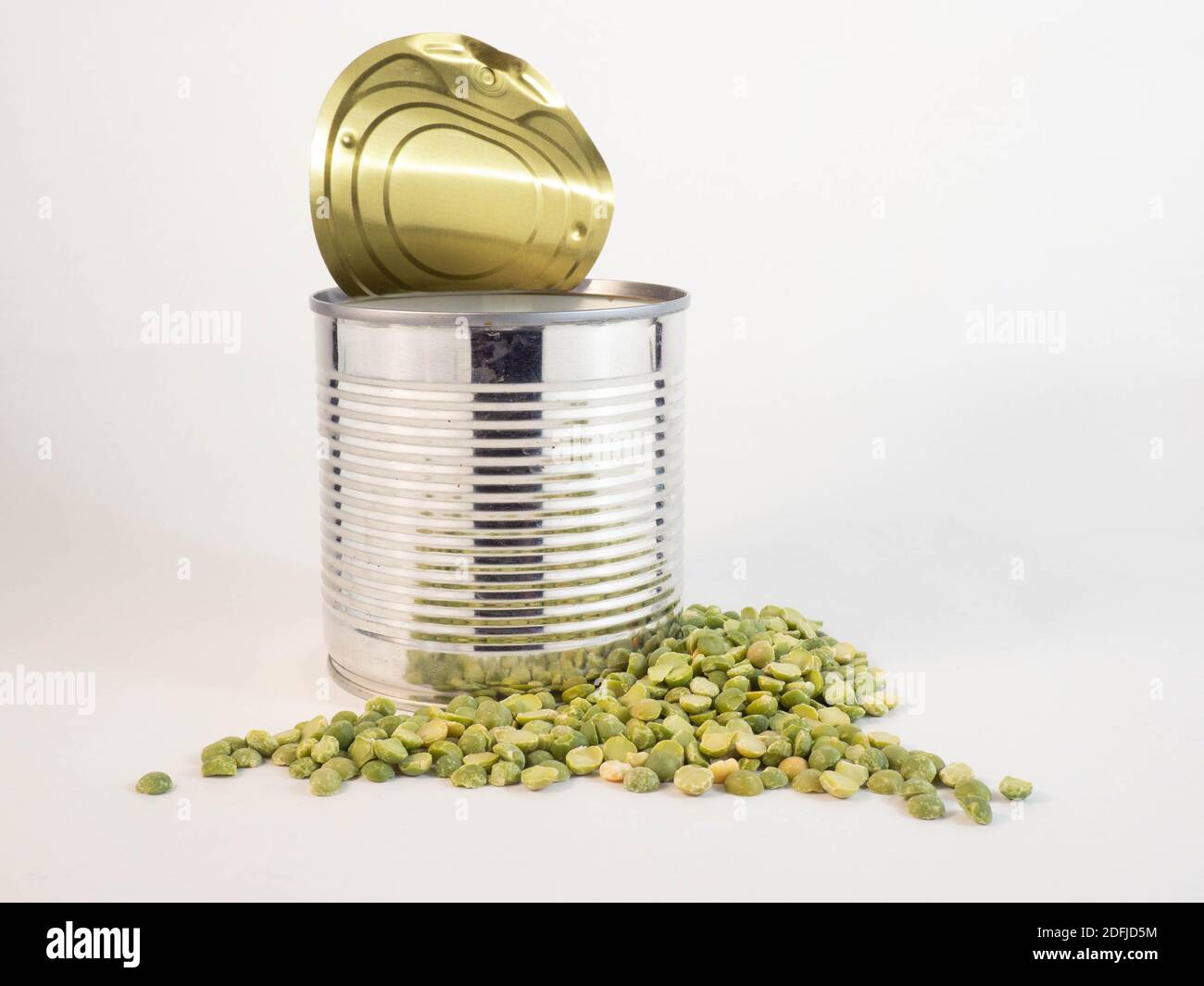 A tin can with split peas. Concept around food and consumption Stock ...