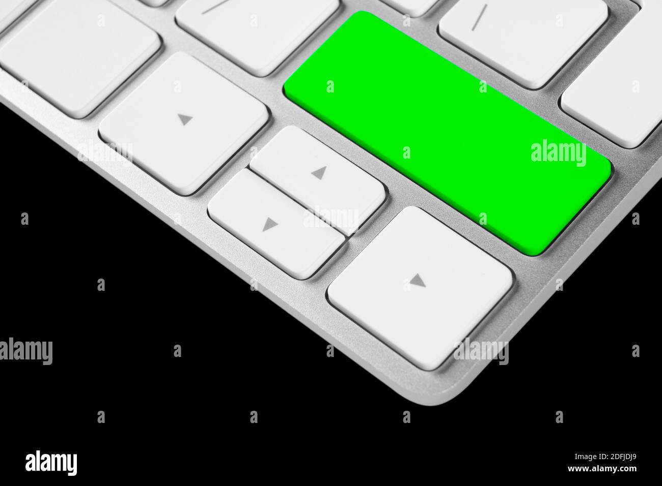 Close up view of a computer notebook keyboard with one green empty ...