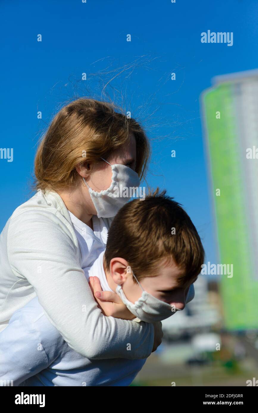 Little sister and brother in casual clothes and protective masks ready ...