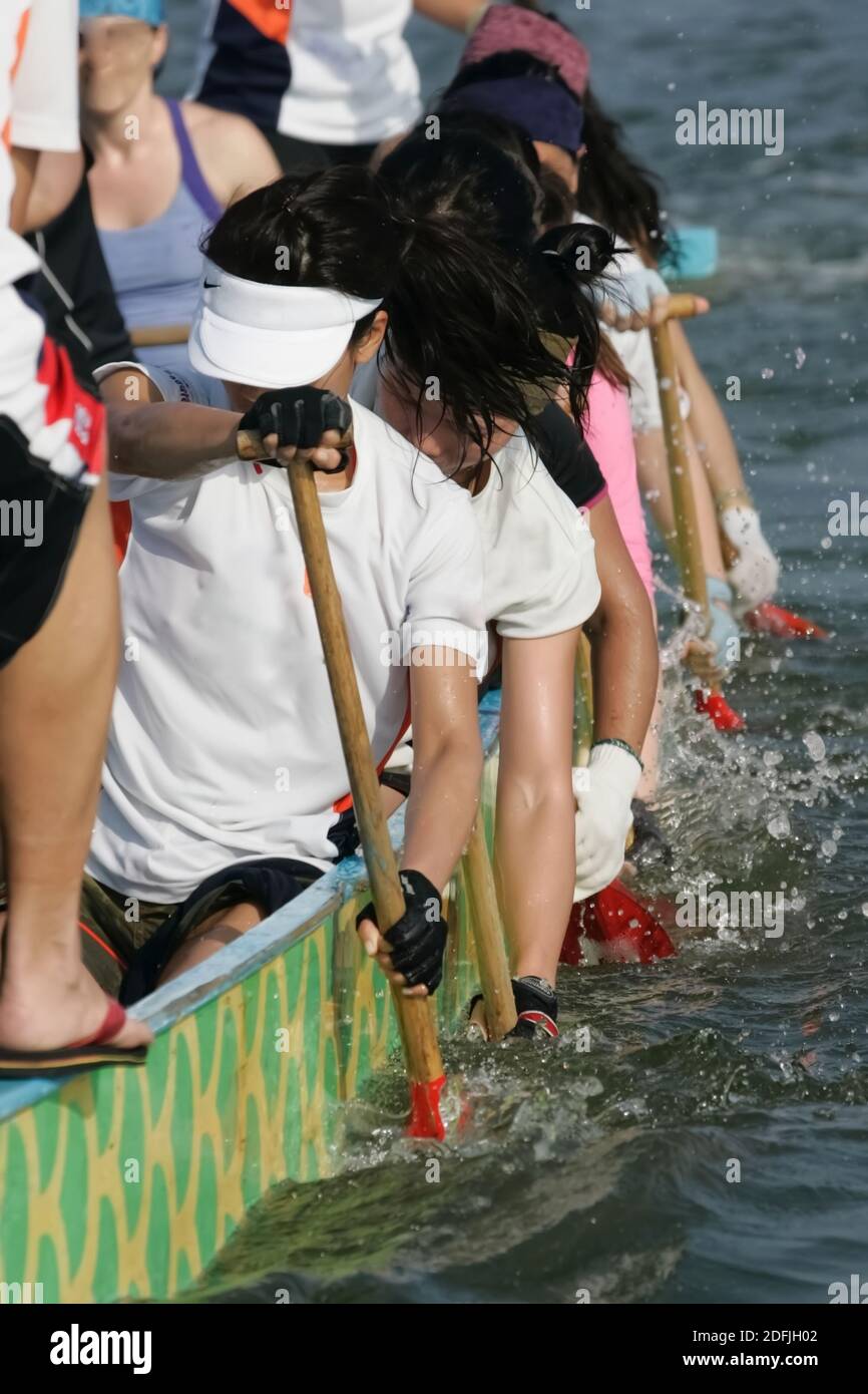 ladies training on a dragon boat Stock Photo - Alamy