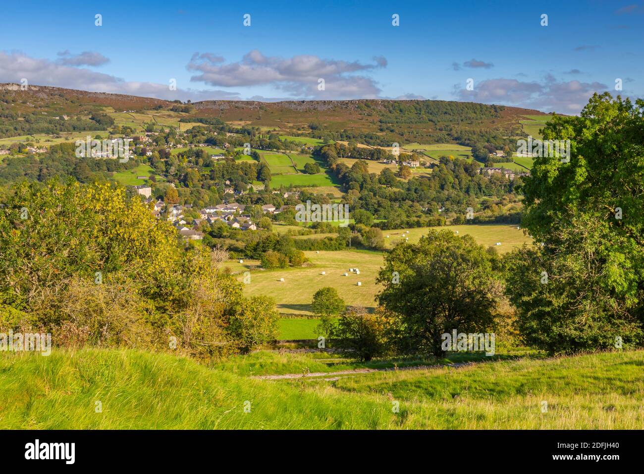 View of Calver village overlooked by Curbar and Baslow Edge, Derbyshire ...