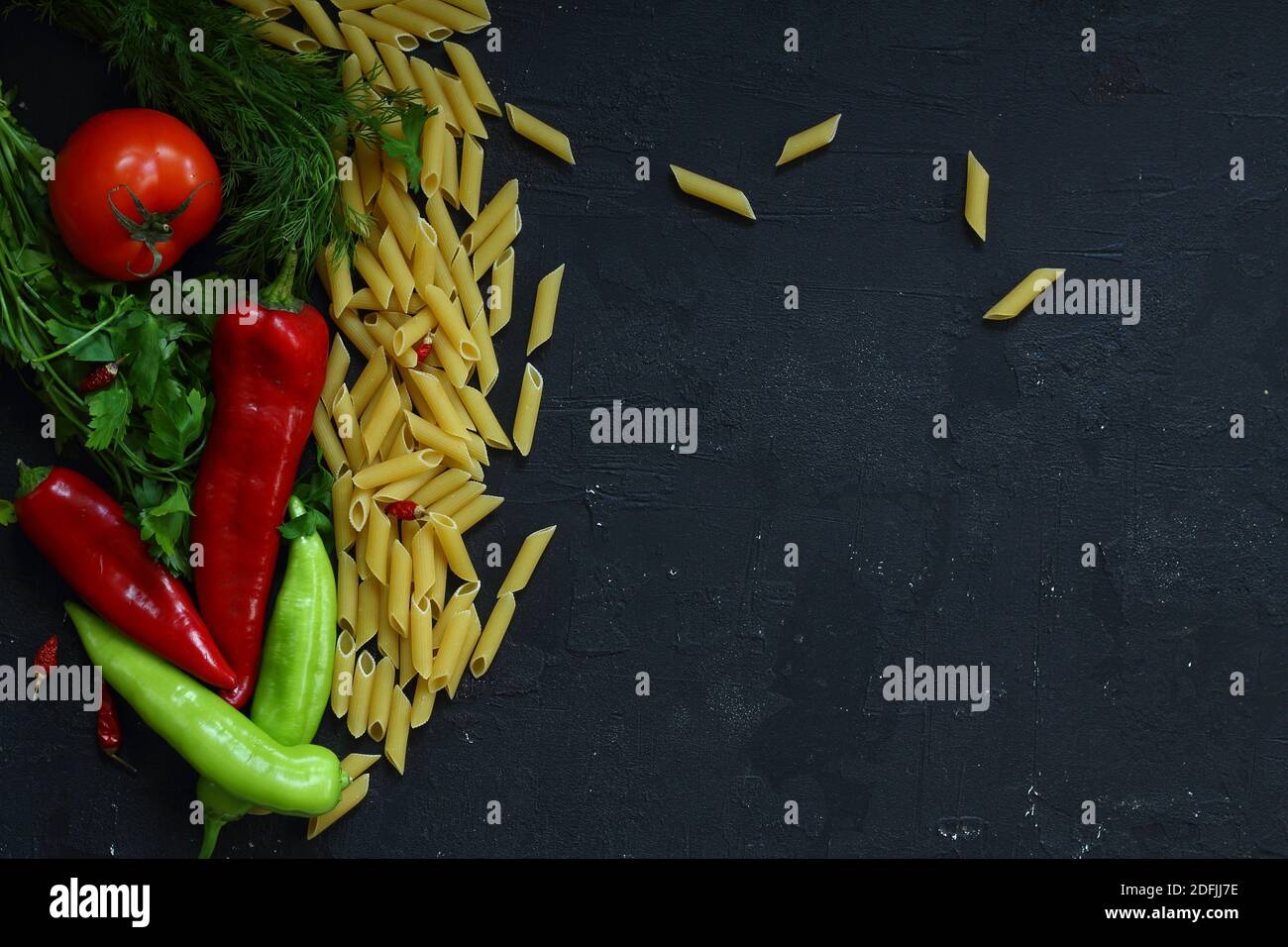 Pasta ingredients on black table, italian cuisine concept Stock Photo ...