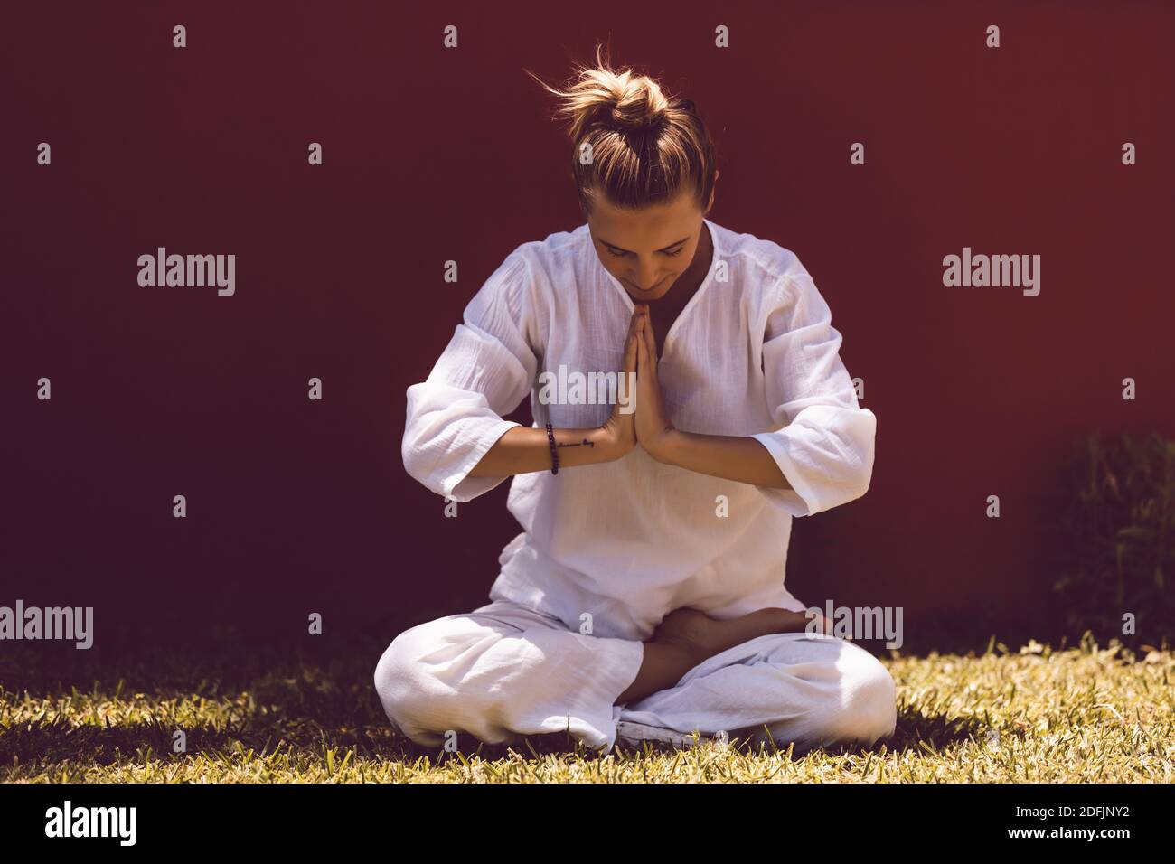 Pretty Woman Dressed in Clean White Clothes Sitting in Lotus Posture ...
