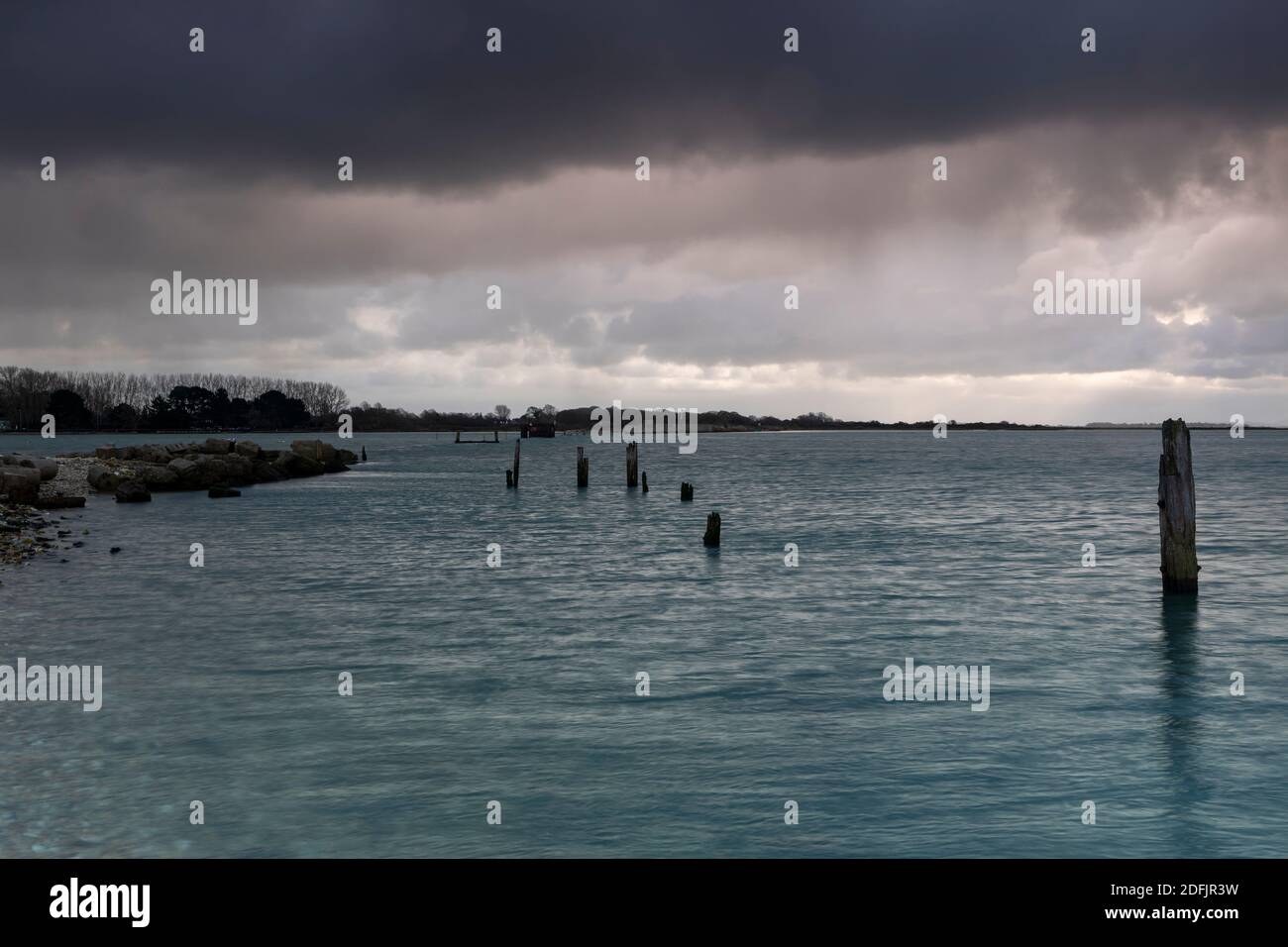 Remains of the Hayling Billy railway bridge on a cloudy winters day ...