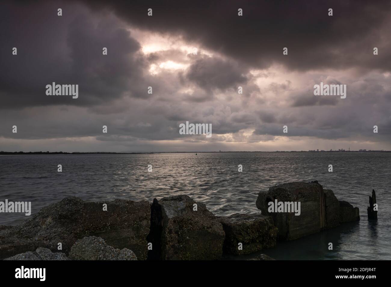 Remains of the Hayling Billy railway bridge on a cloudy winters day ...