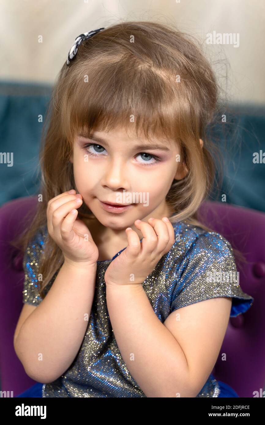adorable little girl in blue dress. portrait of a beautiful little girl ...