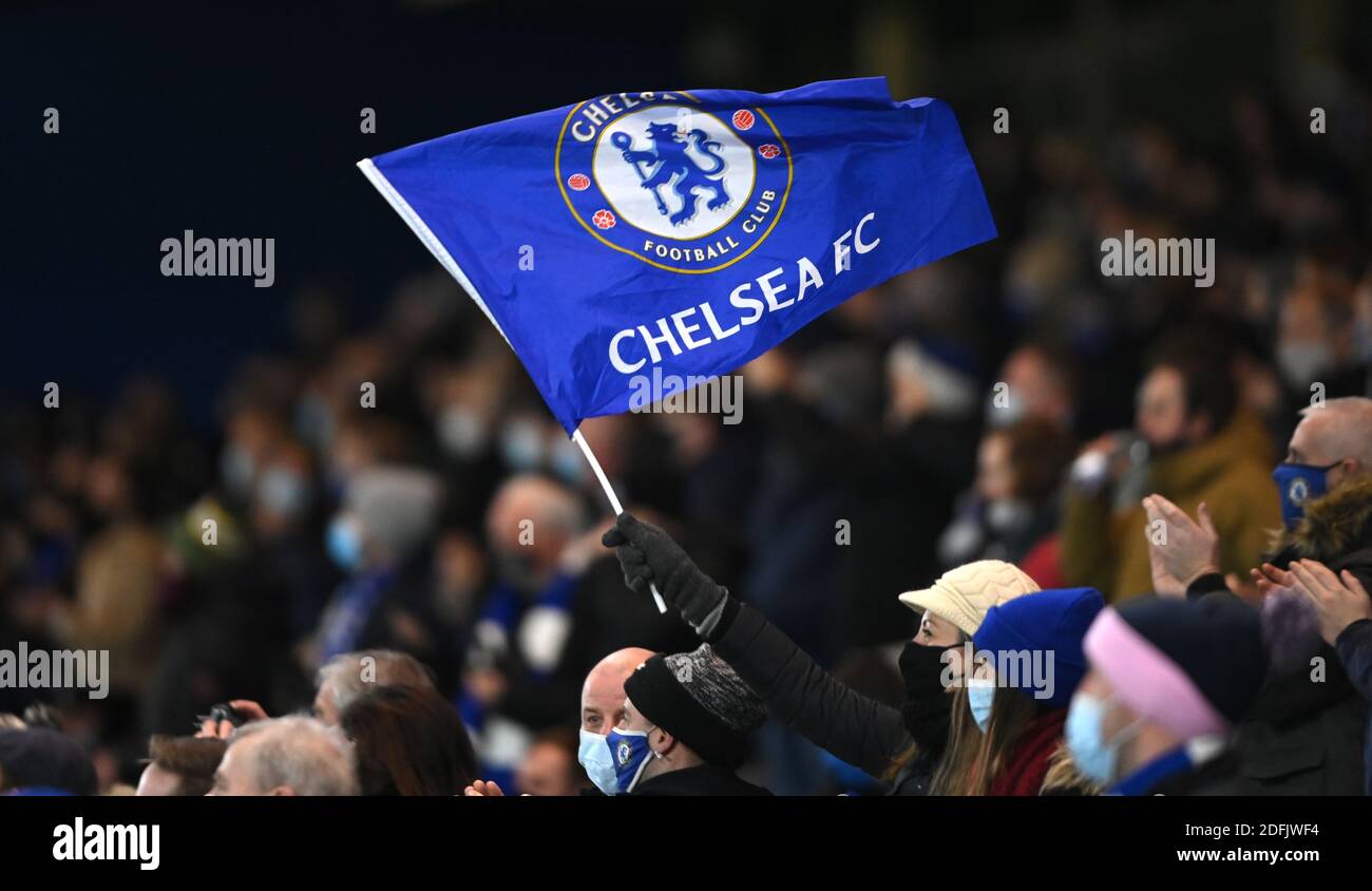 A fan waves a Chelsea flag prior to the Premier League match at ...