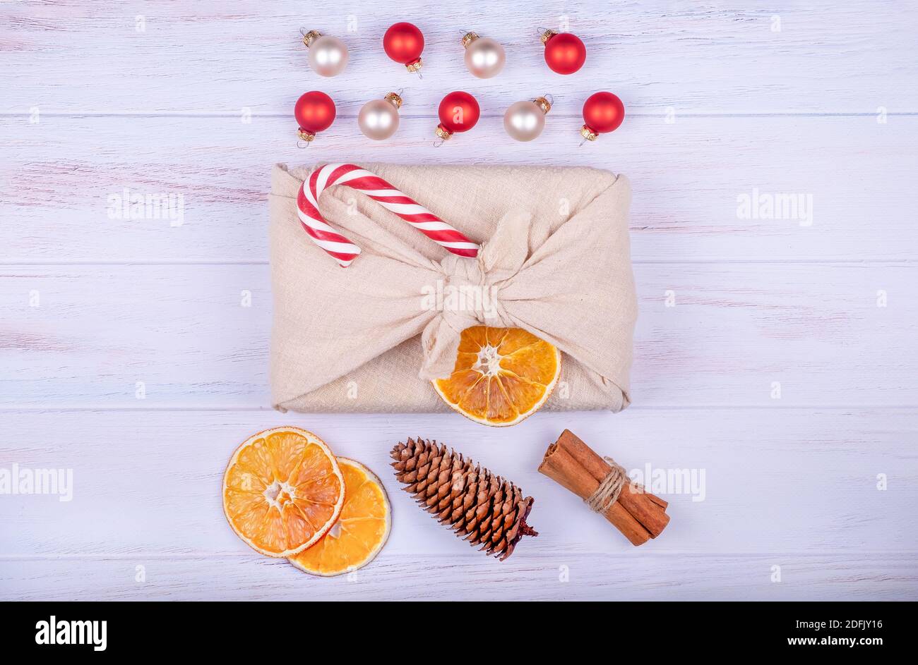 Christmas gift in furoshiki packaging. Zero waste, ecological christmas ...