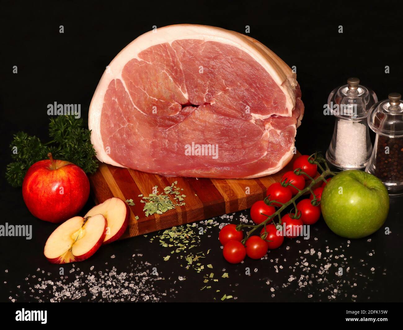 Joint of Gammon Ham on a stripped wooden board ready to be cooked Stock ...