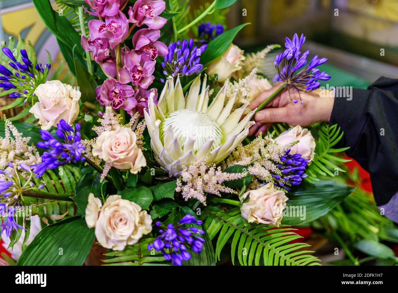 entrepreneur woman working in the flower shop after being able to ...