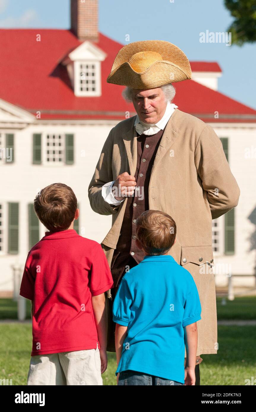 A living historian acting as President George Washington speaks with ...