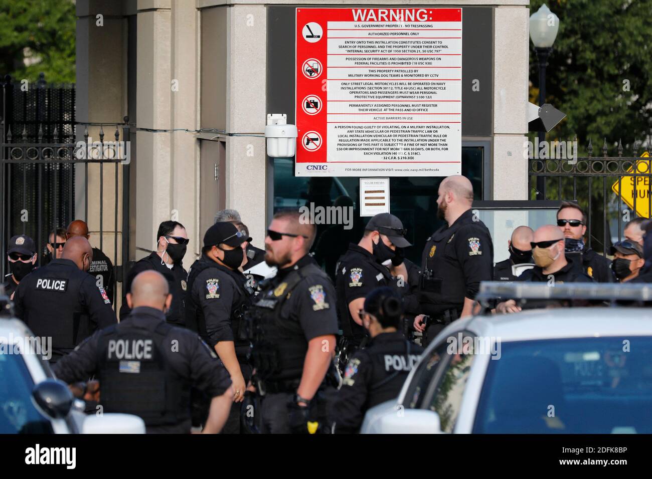Police cars block the entrance of Walter Reed Medical Center during U.S ...