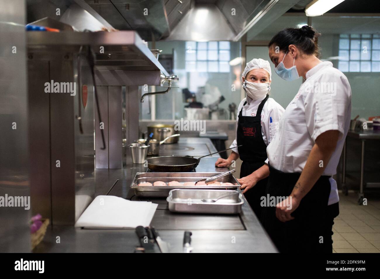 An apprentice listens to cooking teacher Leila Blondeau at the ...