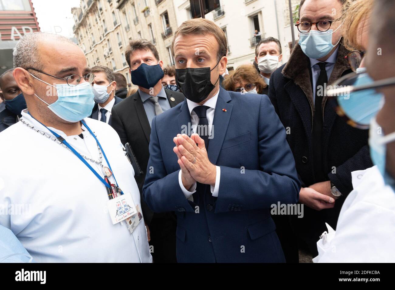 French President Emmanuel Macron talks with caregivers and doctors in ...