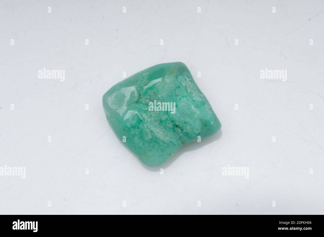 Natural chrysoprase stone on white background Stock Photo - Alamy
