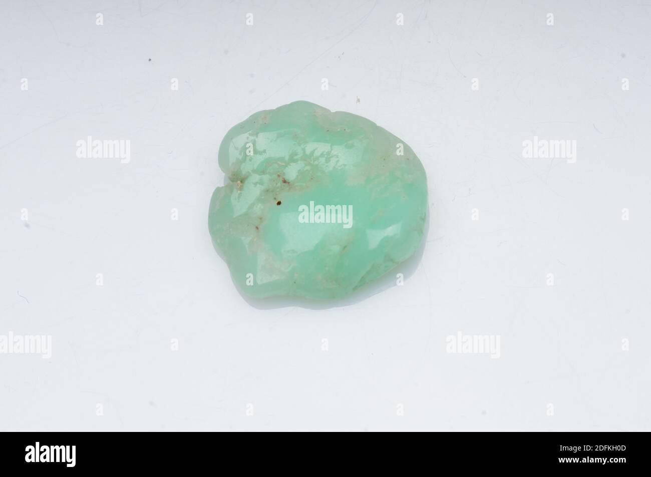 Natural chrysoprase stone on white background Stock Photo - Alamy
