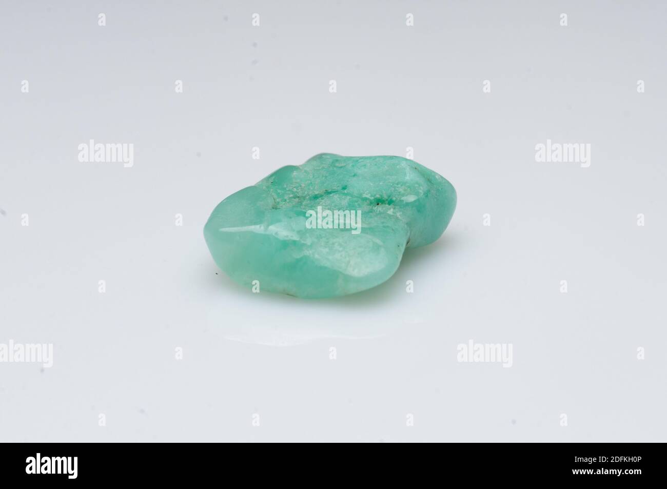 Natural chrysoprase stone on white background Stock Photo - Alamy
