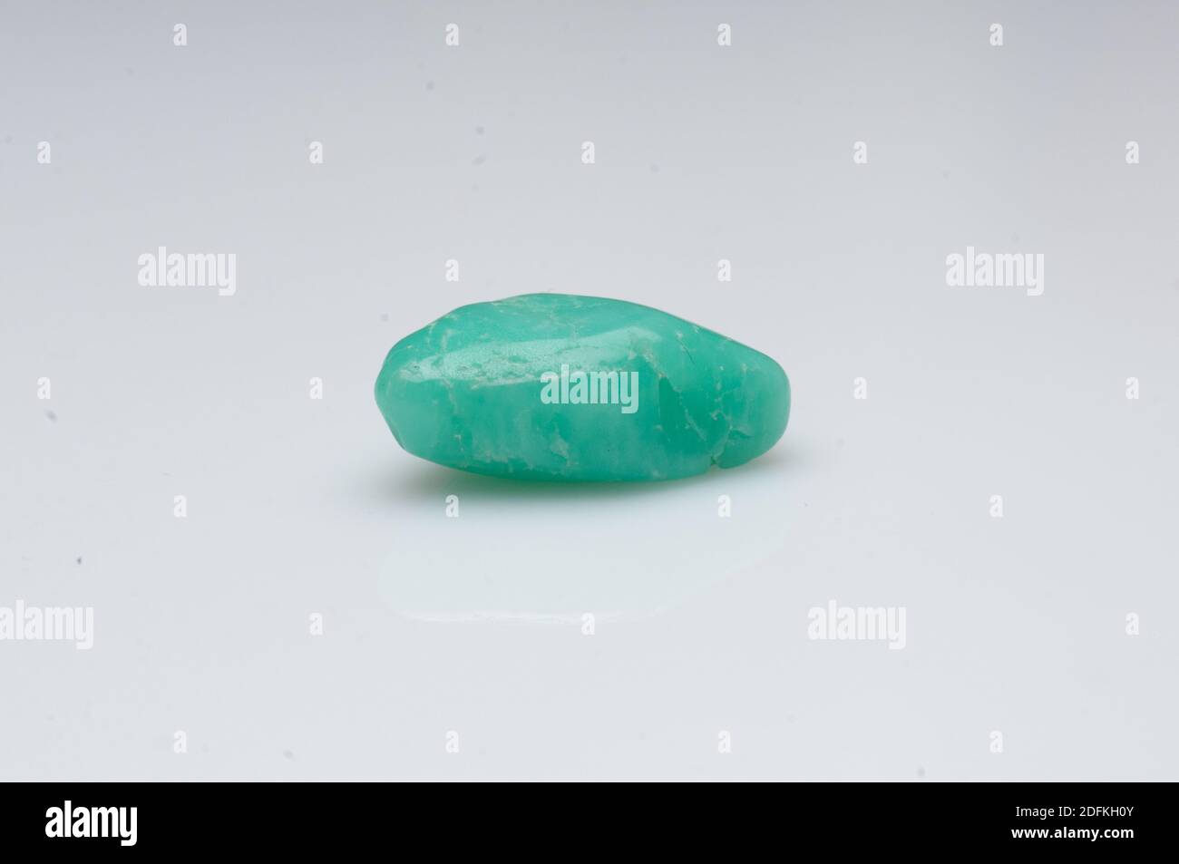 Natural chrysoprase stone on white background Stock Photo - Alamy