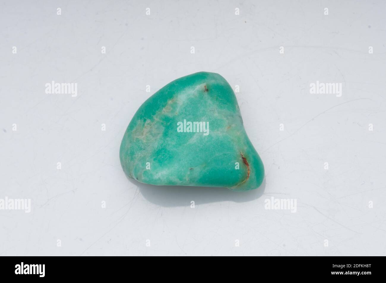 Natural chrysoprase stone on white background Stock Photo - Alamy