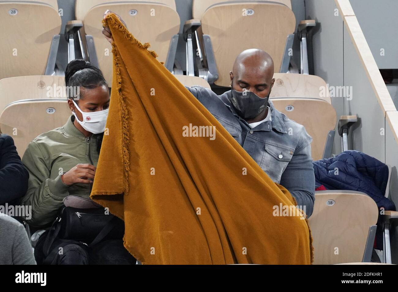 Teddy Riner and his wife Luthna Plocus attend the French Open at Roland ...