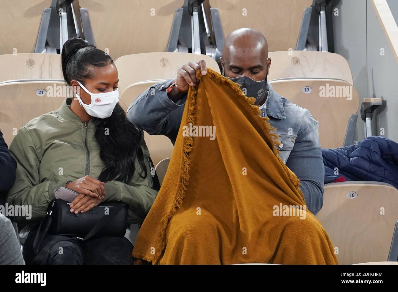 Teddy Riner and his wife Luthna Plocus attend the French Open at Roland ...