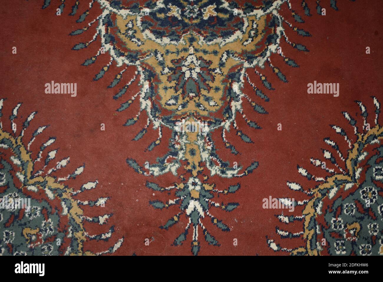 A closeup shot of an old carpet with traditional folk patterns for an ...