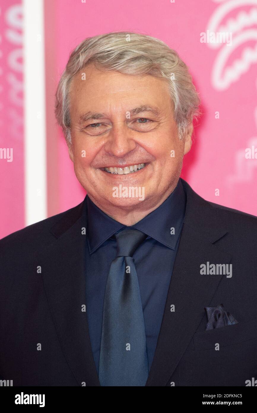 Paul Zilk poses on the pink carpet prior to the closing ceremony of the ...