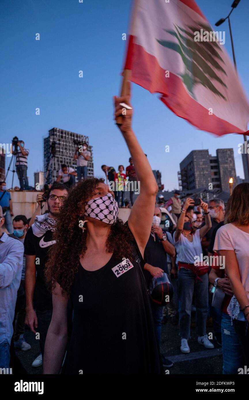Lebanese demonstrate and light up the « Revolution Flame » as they mark ...