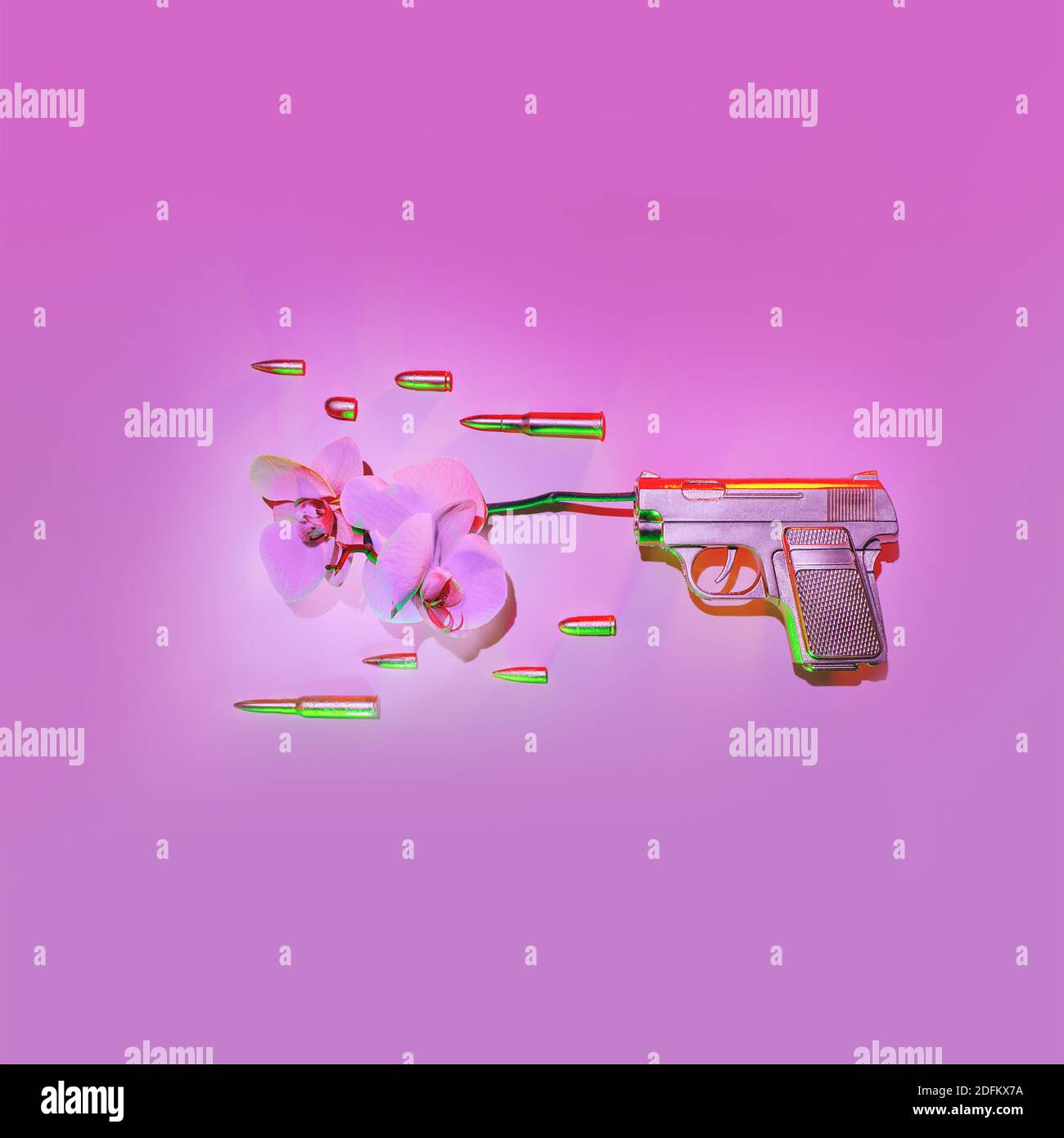 The golden gun shoots an orchid flower, next to fly bullets on a pink ...