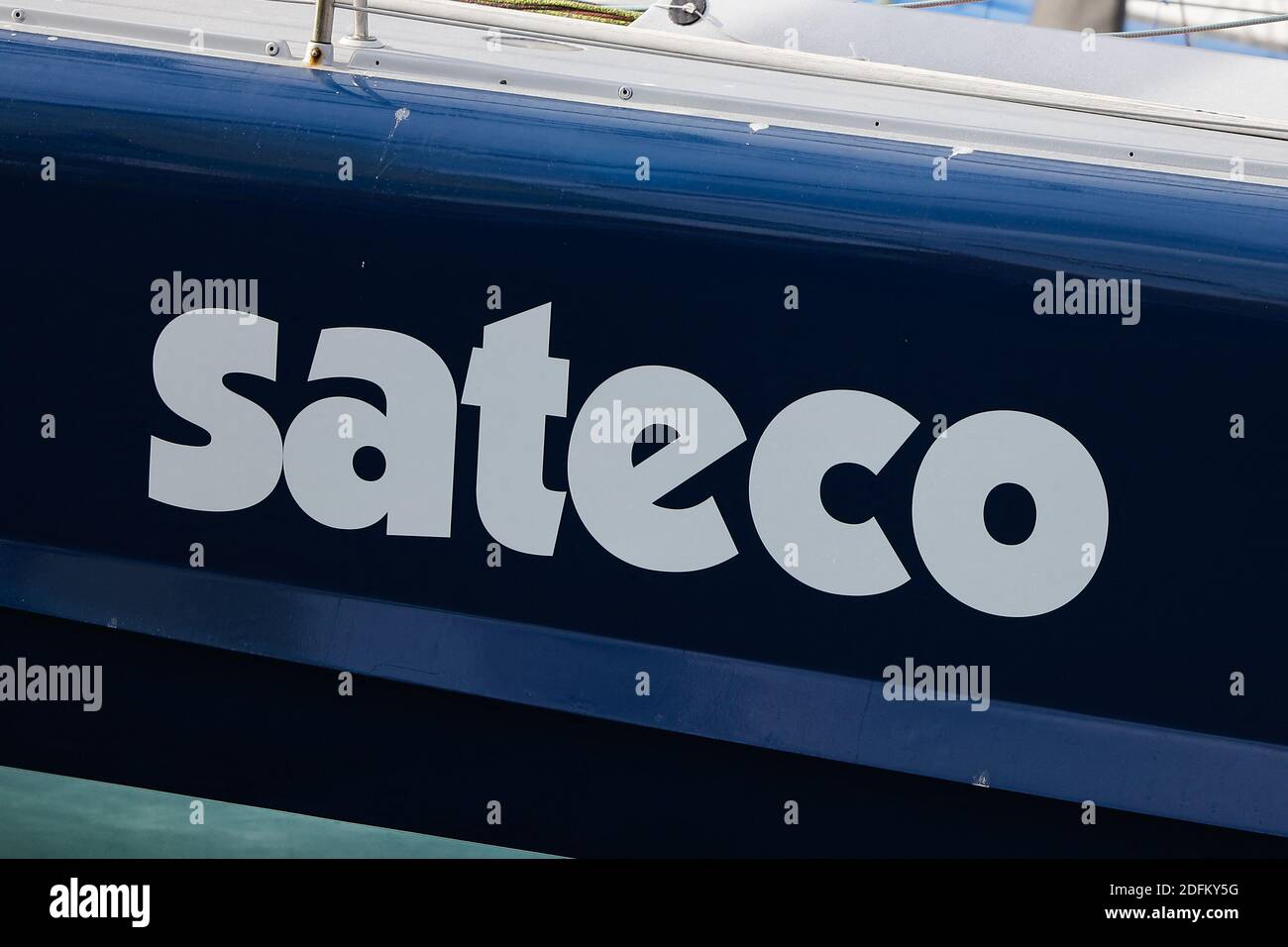 Sponsors' logo Sateco on competitors' boats at the starting site of the ...