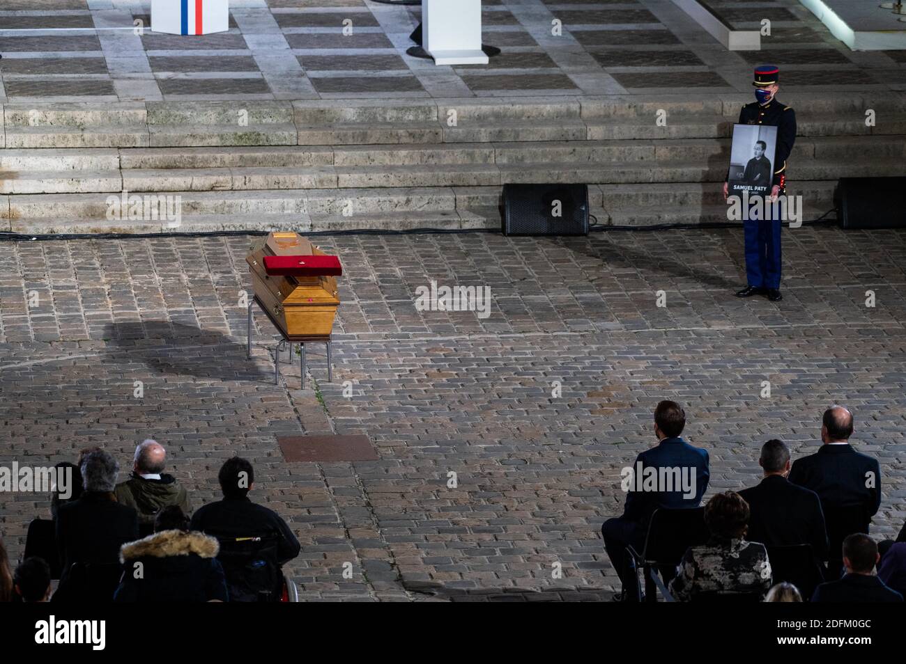 French President Emmanuel Macron stands in front of Samuel Paty's ...