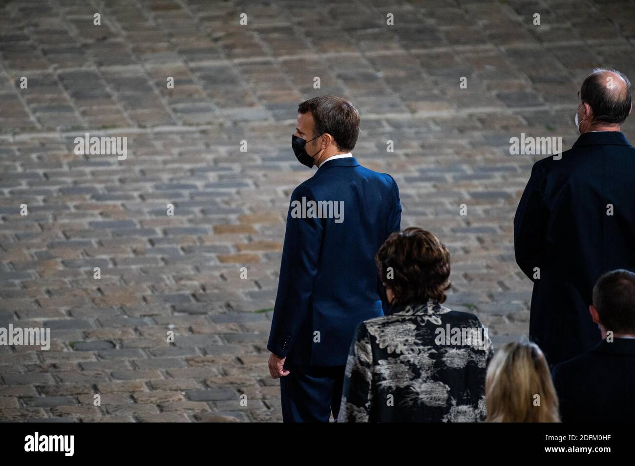French President Emmanuel Macron stands in front of Samuel Paty's ...