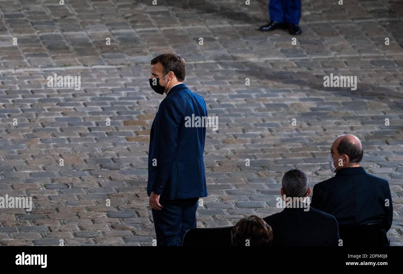 French President Emmanuel Macron stands in front of Samuel Paty's ...