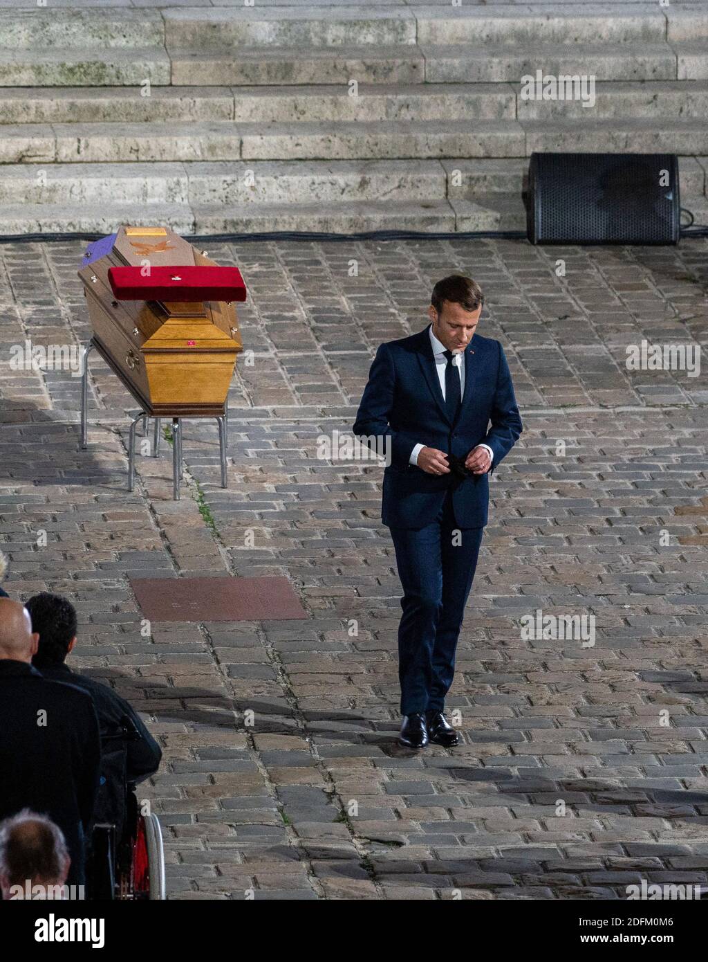 French President Emmanuel Macron stands in front of Samuel Paty's ...