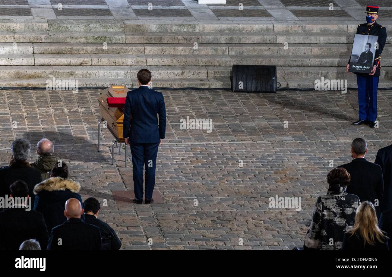 French President Emmanuel Macron stands in front of Samuel Paty's ...