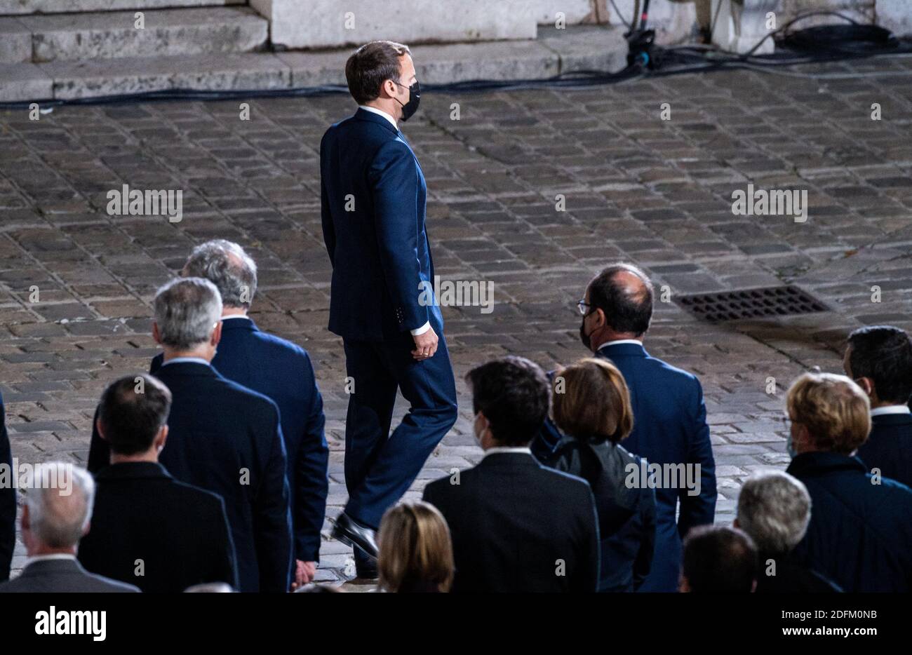 French President Emmanuel Macron stands in front of Samuel Paty's ...