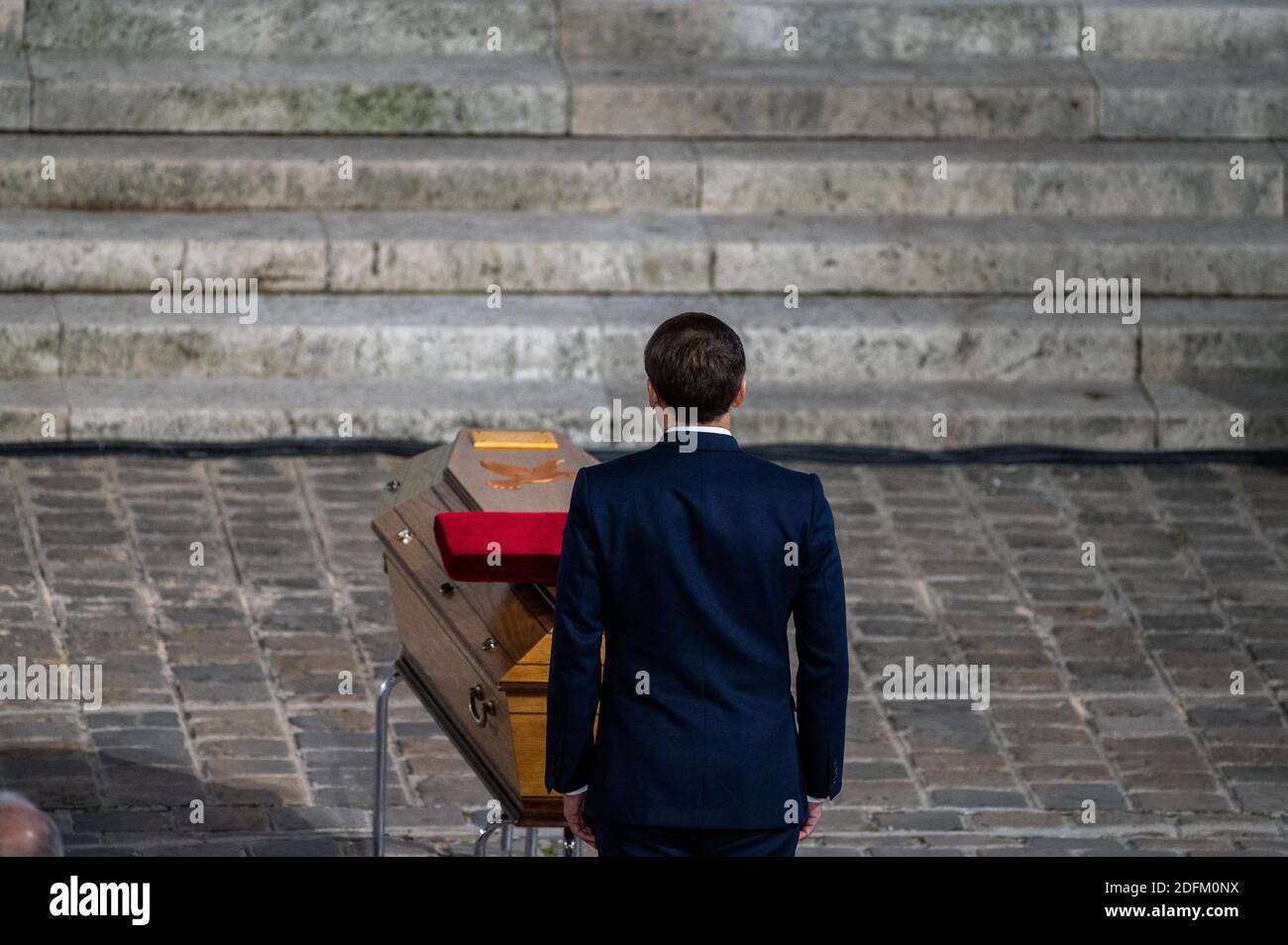 French President Emmanuel Macron stands in front of Samuel Paty's ...
