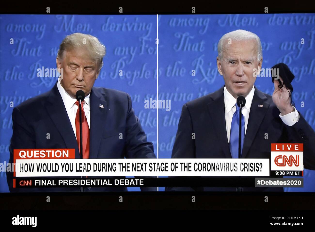Democratic presidential nominee Joe Biden holds a face mask during ...