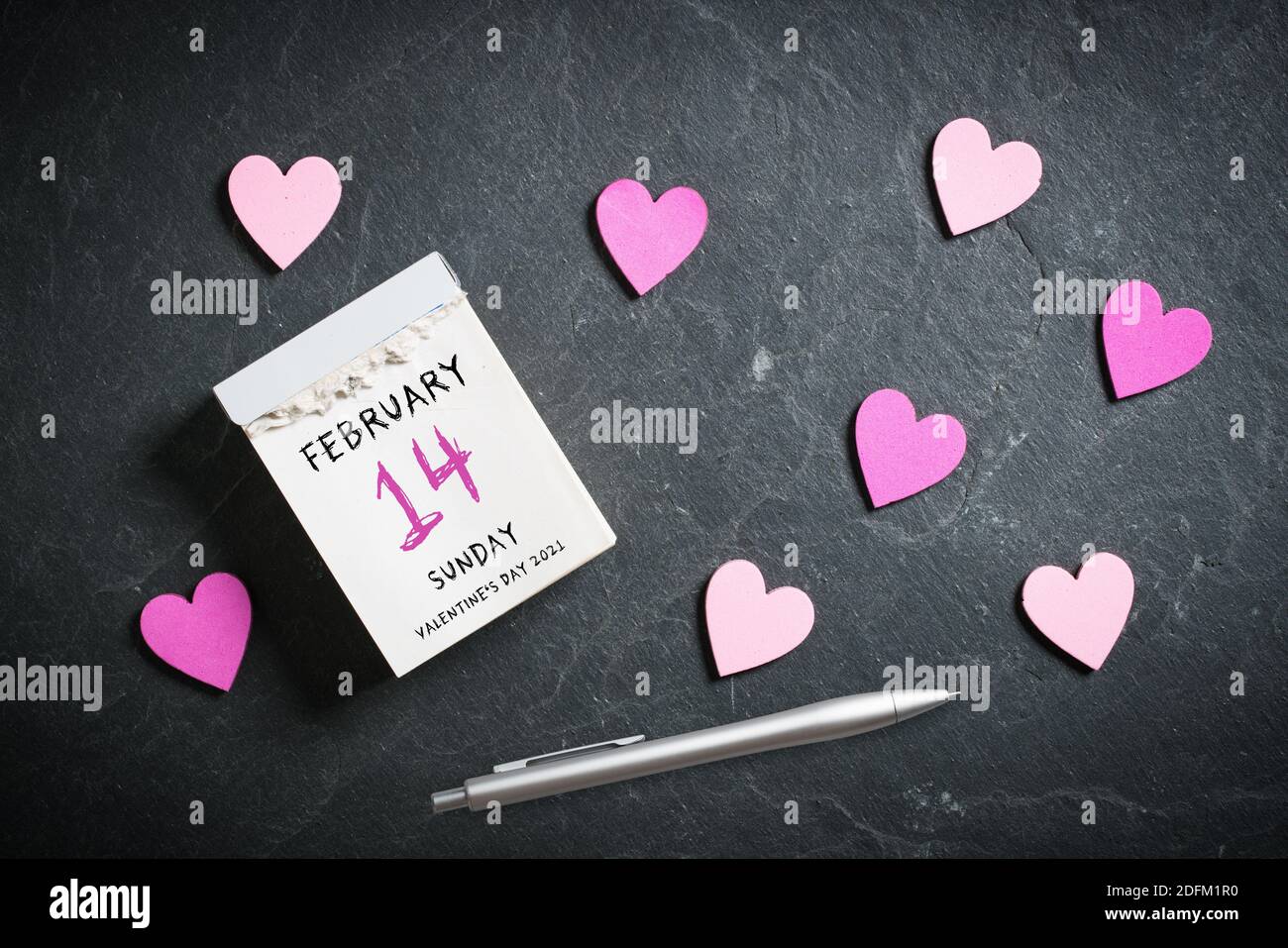 tear-off calendar with Valentine's Day 2021 and heart decoration on top ...