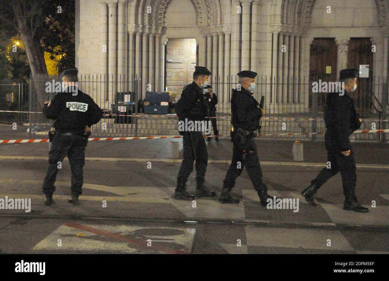 Police stand at night in front of Notre Dame Basilica on October 29 ...