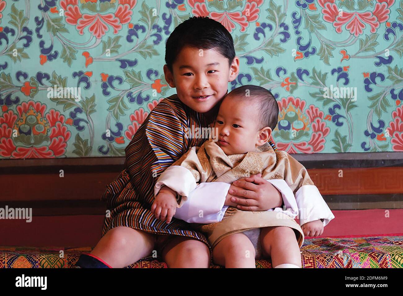 His Royal Highness Gyalsey Jigme Namgyel of Bhutan lovingly holds ...