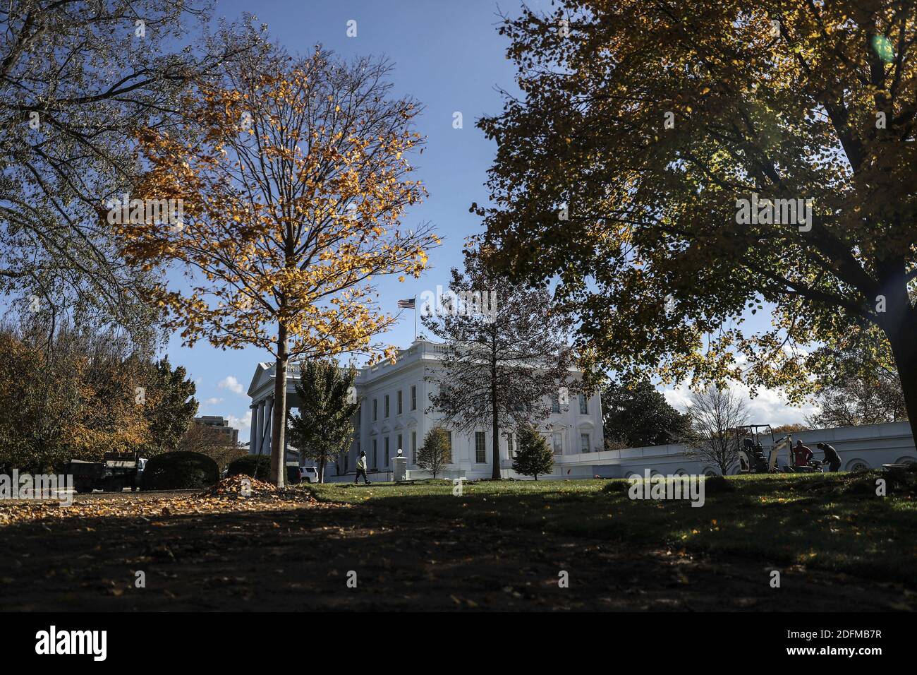 Grounds keepers work of the North Lawn of the White House on Tuesday ...
