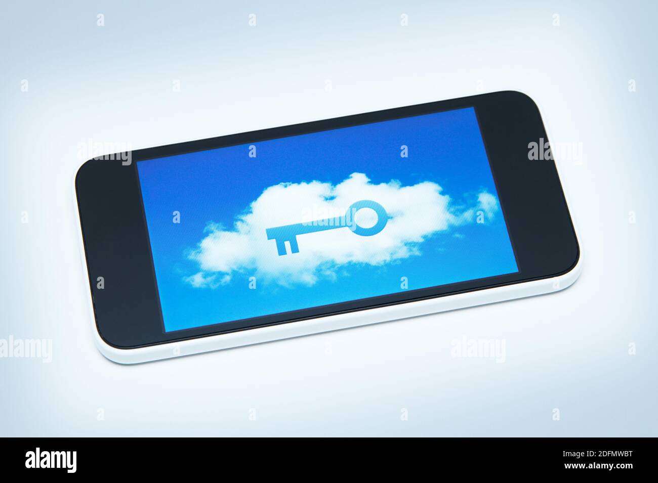 Secure smart phone with a key over a cumulus cloud on its screen. All ...