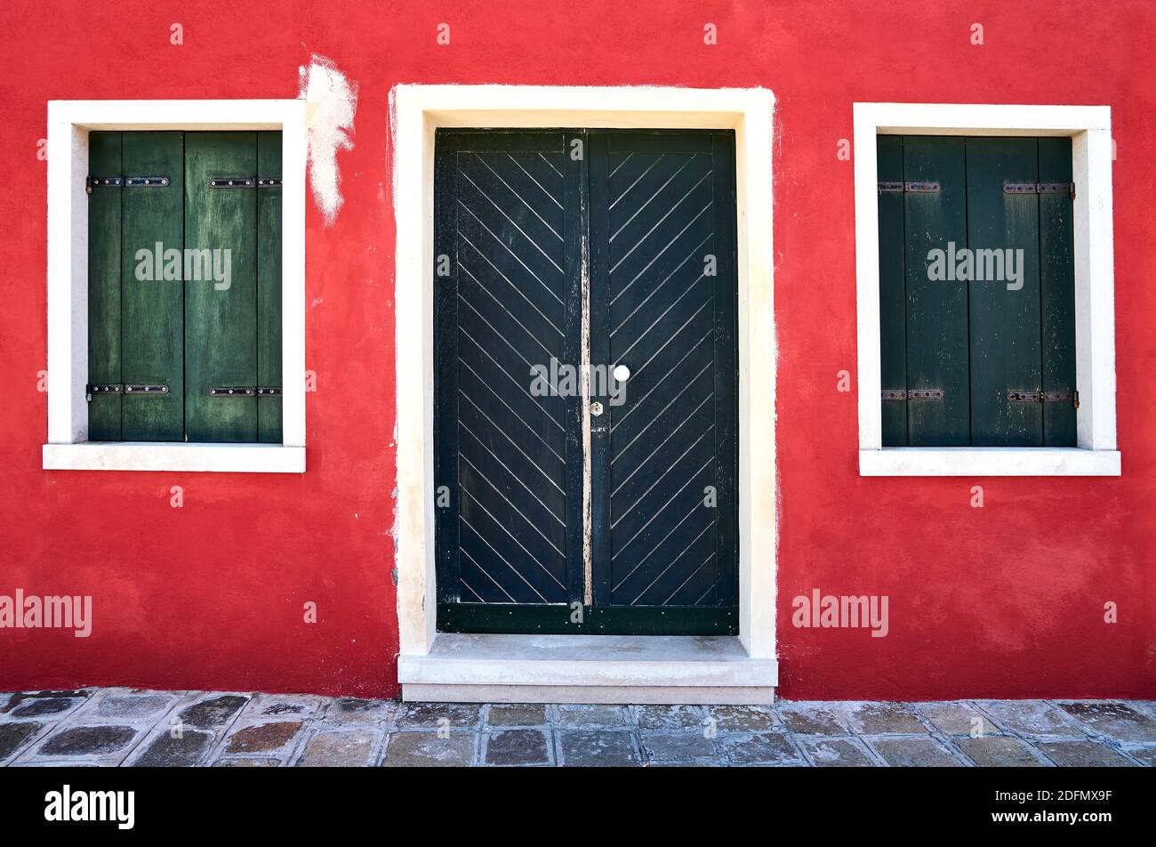 Colorful house on Burano island, Venice, Italy. Front view Stock Photo ...