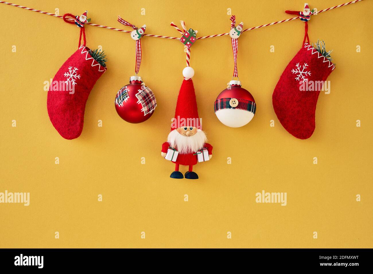 Christmas background. Red Christmas decoration and Santa Claus hanging ...