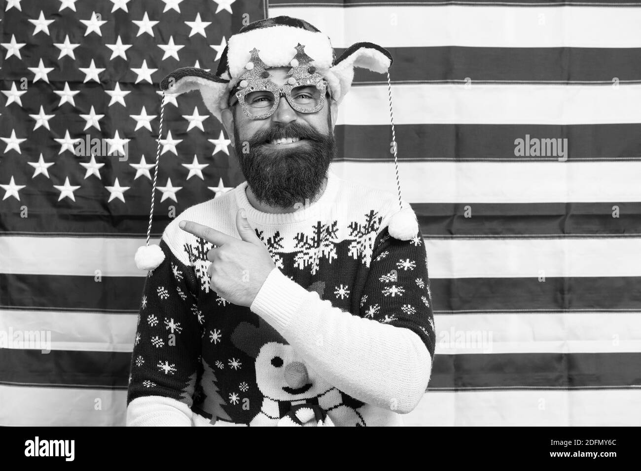 Hey look. Happy hipster point index finger at something. Bearded man ...